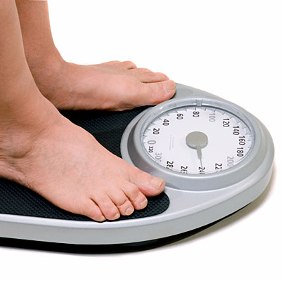 Overweight Person On Scale