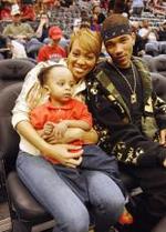 Singer Monica and her Lil Rock catch a home game